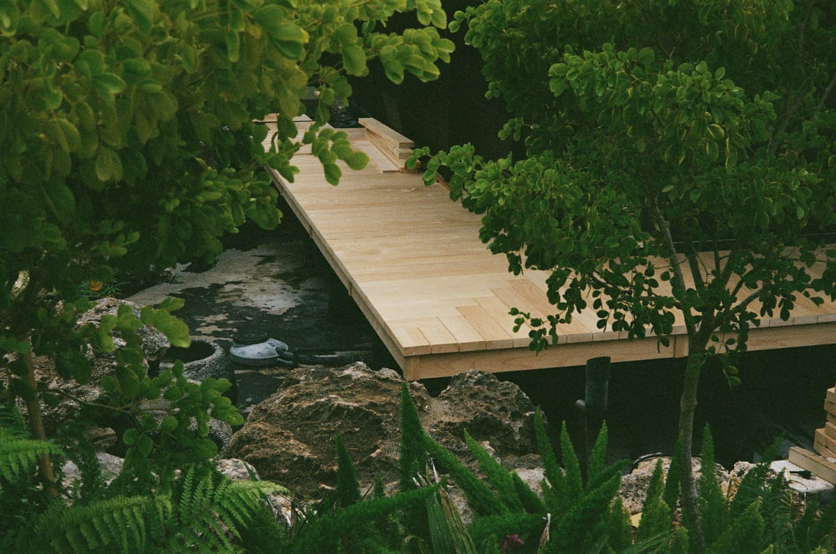 Hand planing a walkway (over a koi pond)
